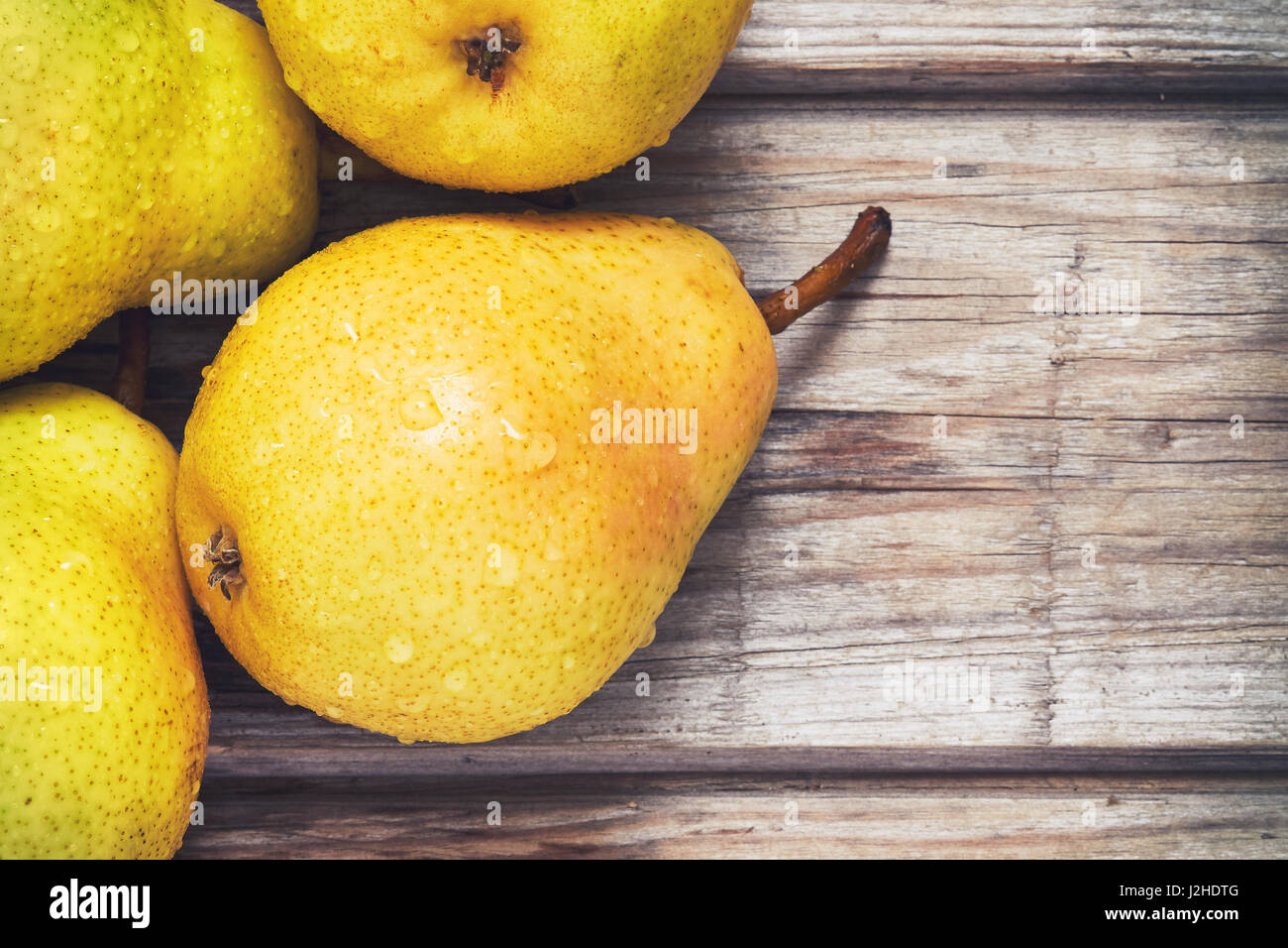 Fresh williams pears (Bartlett pear) on wooden background. Top view ...
