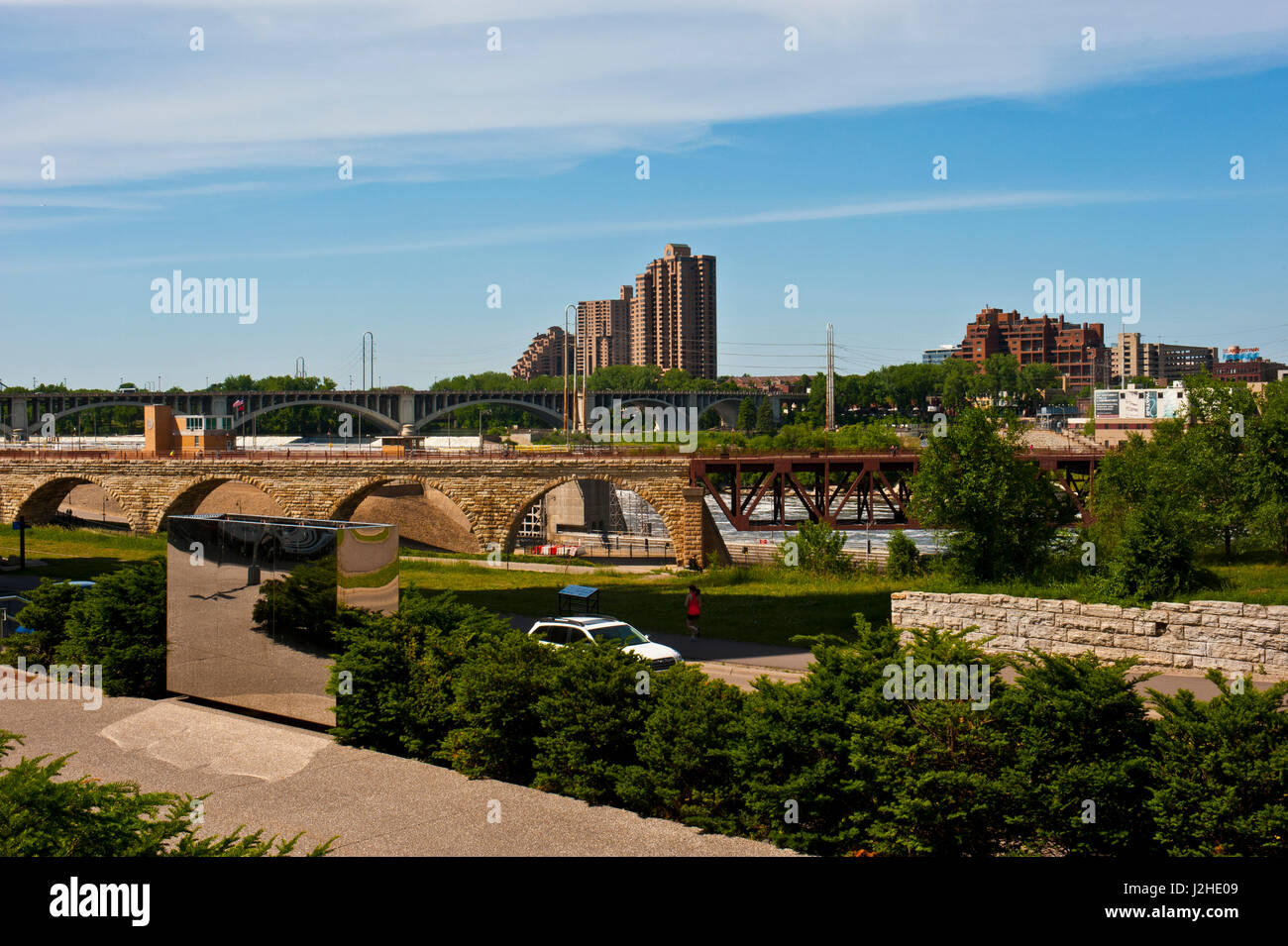 Minnesota, Minneapolis Mill Ruins Park. Stone Arch Bridge over ...