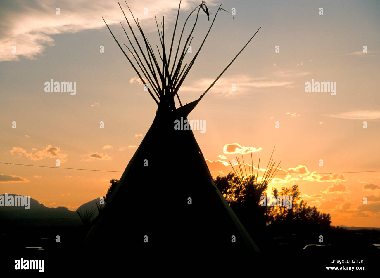 Blackfeet tepees made from canvas stretched over tipi poles at sunset ...