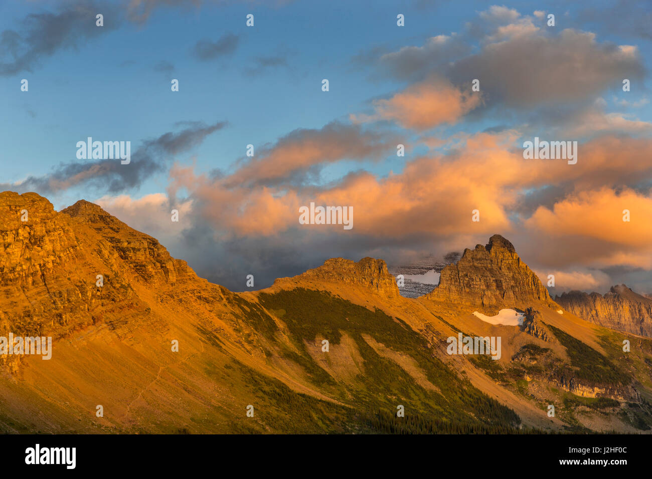 The Garden Wall and Mt Gould bathed in sunset light in Glacier National ...
