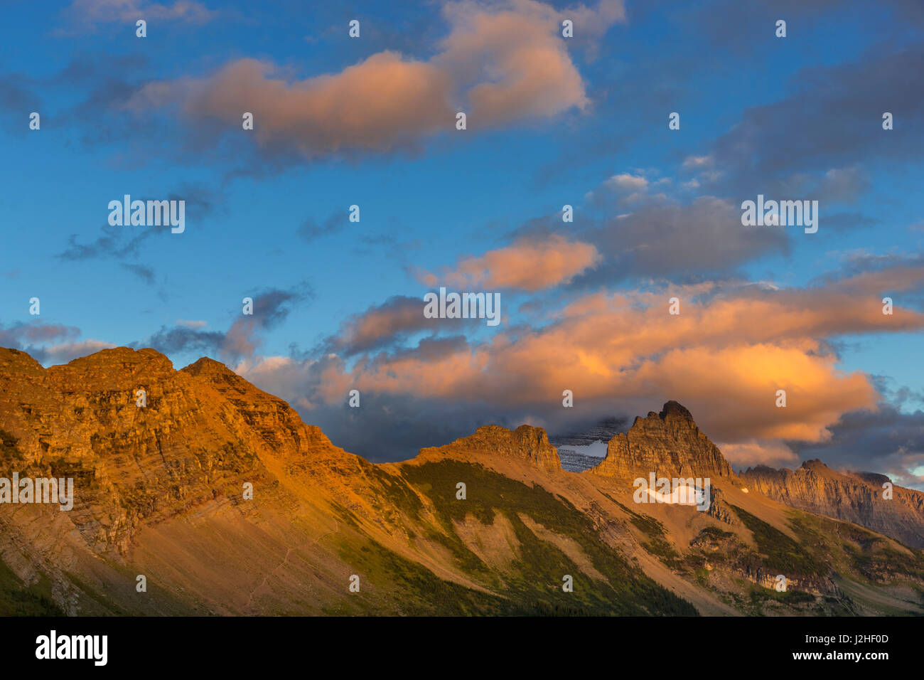 The Garden Wall and Mt Gould bathed in sunset light in Glacier National ...