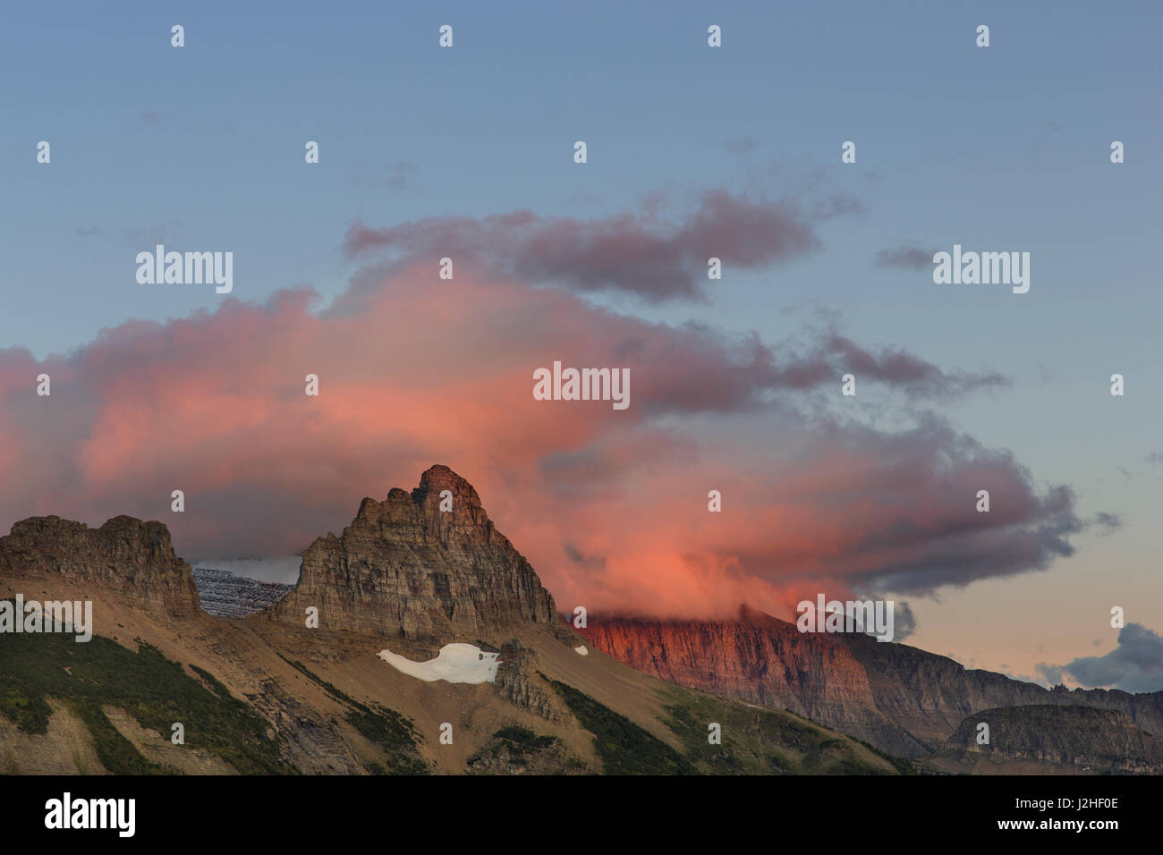 The Garden Wall and Mt Gould bathed in sunset light in Glacier National ...