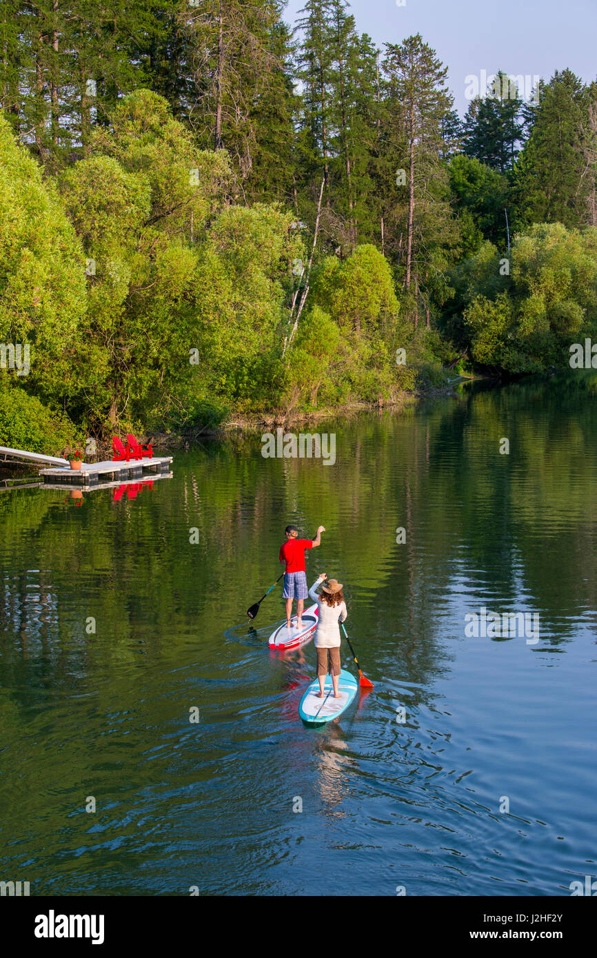 Paddleboarding on the Whitefish River in Whitefish, Montana, USA (MR ...