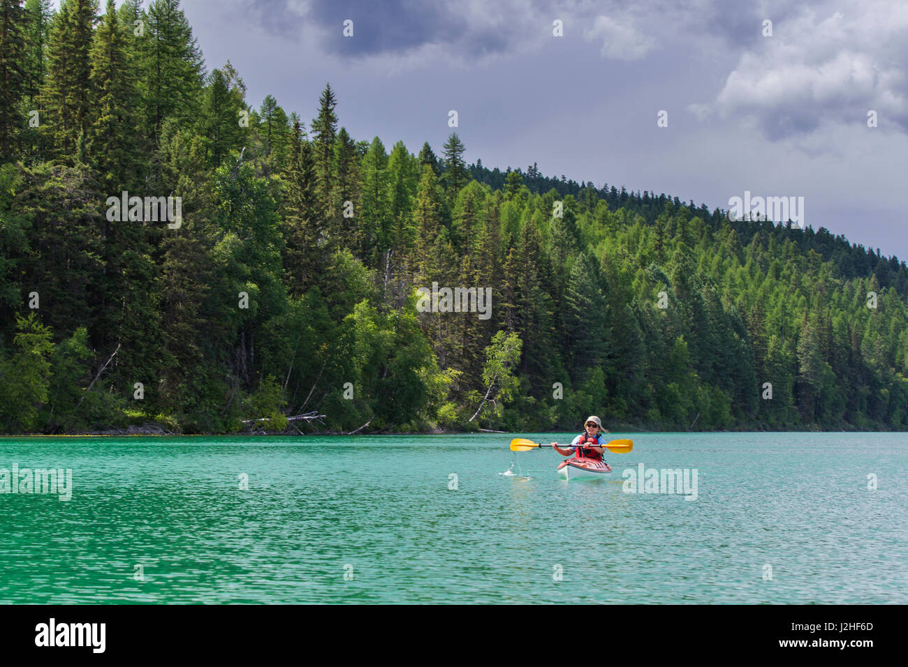 Kayaking on Beaver Lake near Whitefish, Montana, USA (MR Stock Photo ...