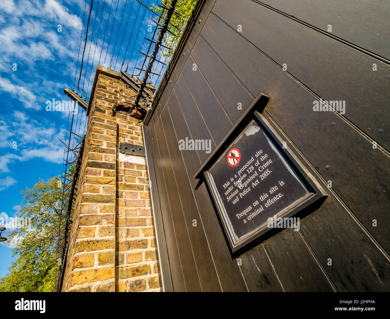 Warning sign and barriers along perimeter wall of buckingham Palace ...