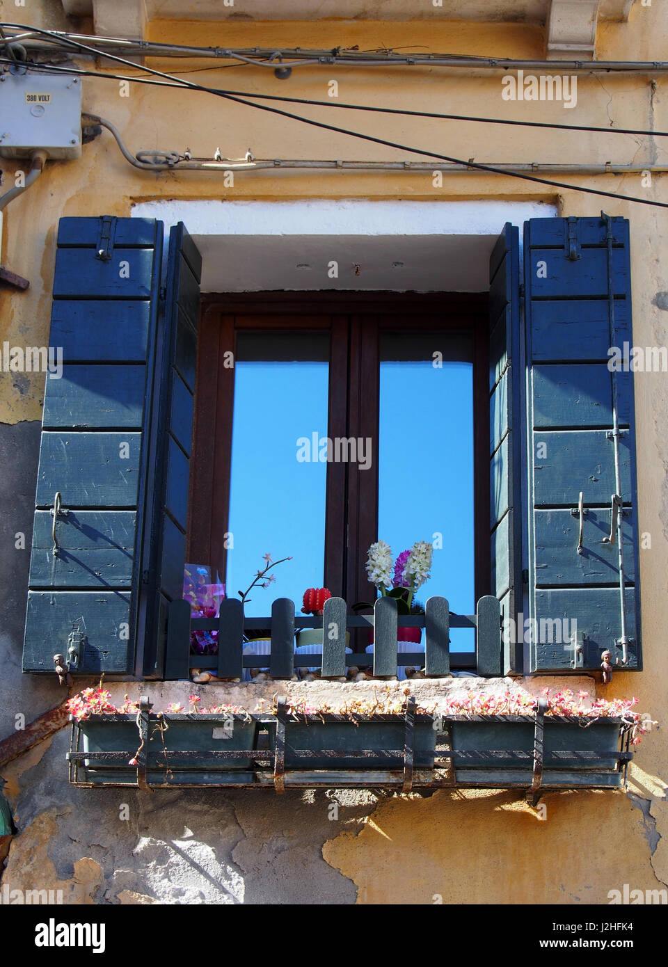 venice window with blue shutters and flowers Stock Photo - Alamy