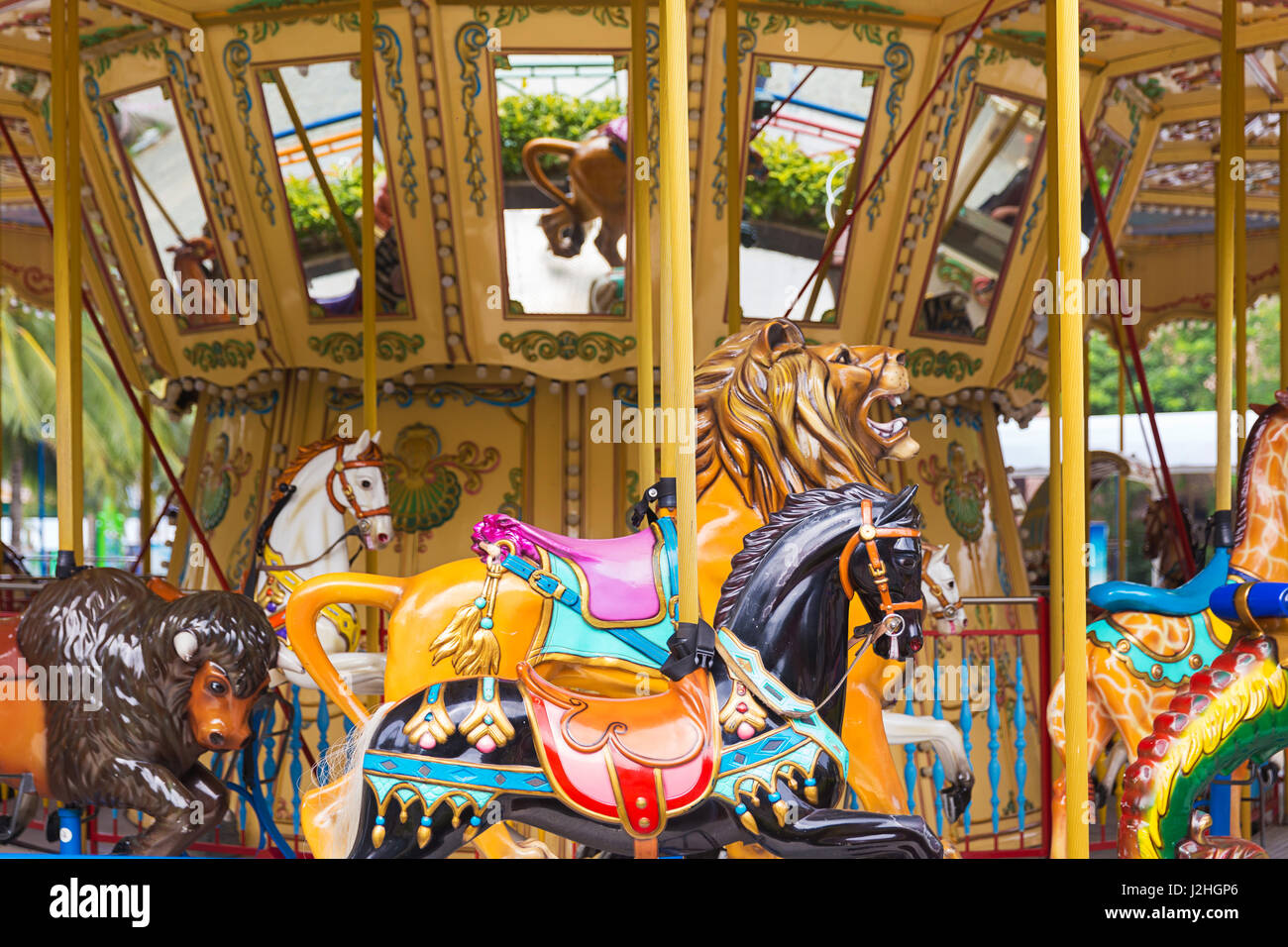 Pretty carousel adventure in an amusement entertainment park Stock ...