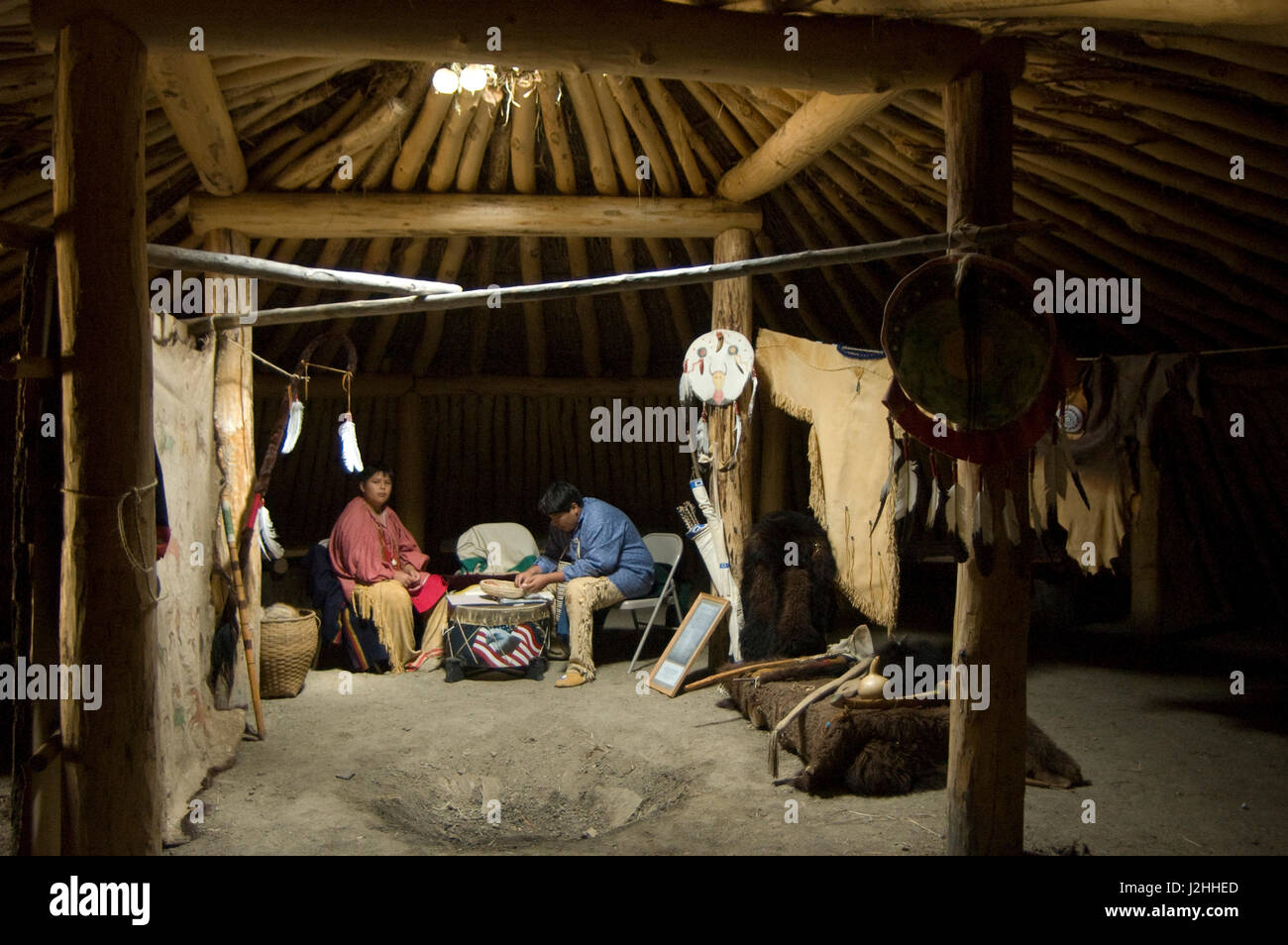 Interior of a traditional furnished Mandan dome shaped lodge built with ...