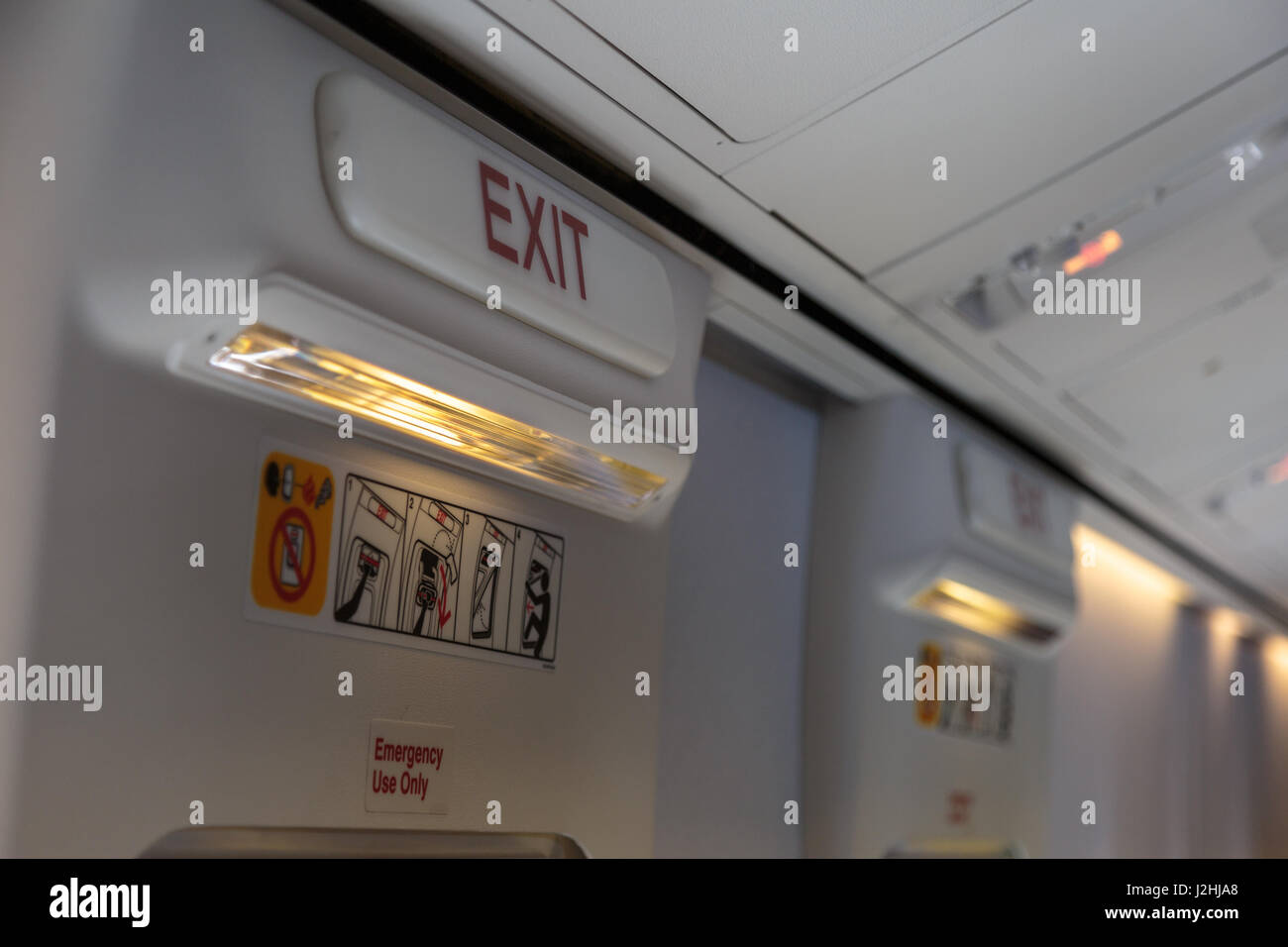 Emergency Exit and Light in Aircraft Cabin Stock Photo - Alamy