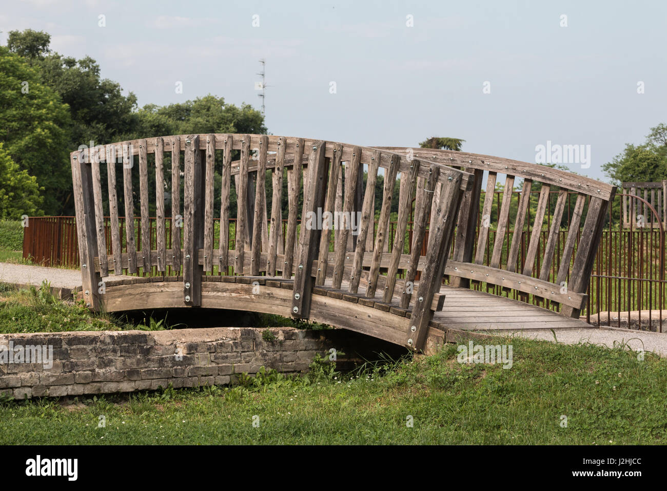Little Pedestrian Curved Wooden Bridge in a Park Stock Photo - Alamy