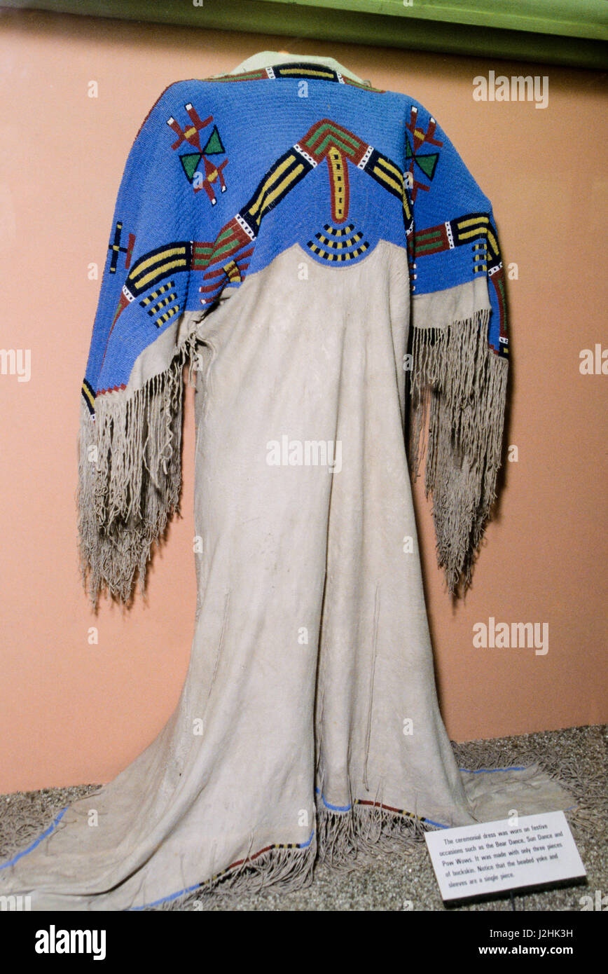 Geometric beadwork decorates this Ute woman's deer hide dress with ...