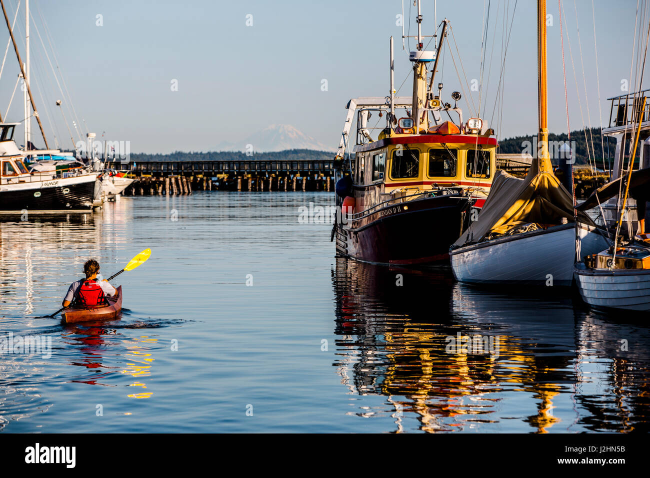 Port Townsend, Washington State. Woman in a canoe on the Puget Sound ...