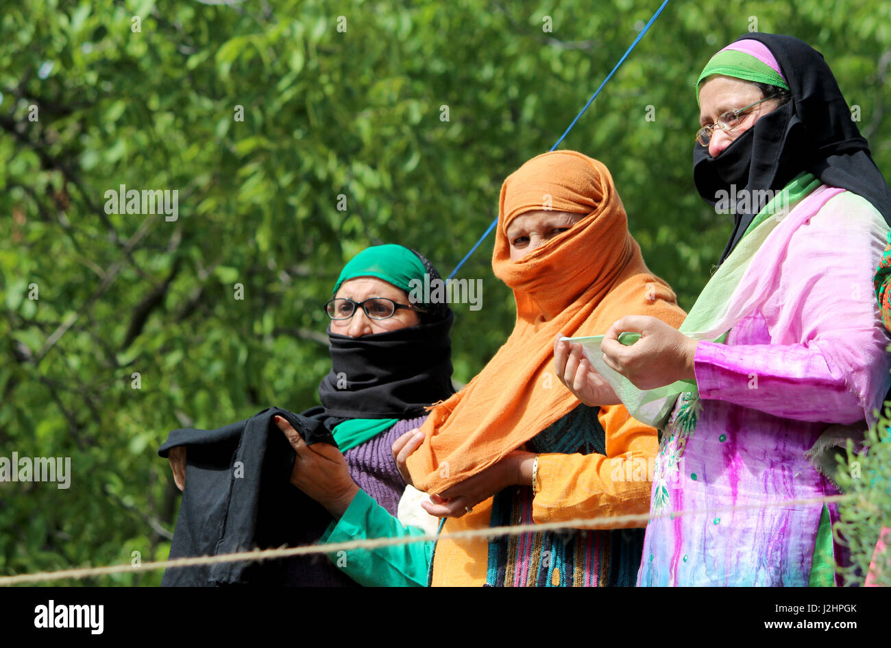 Anantnag, India. 28th Apr, 2017. Kashmiri Muslims look towards a cleric ...