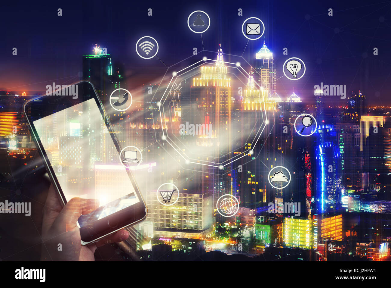 Mobile with wireless communication network and night city background. E ...