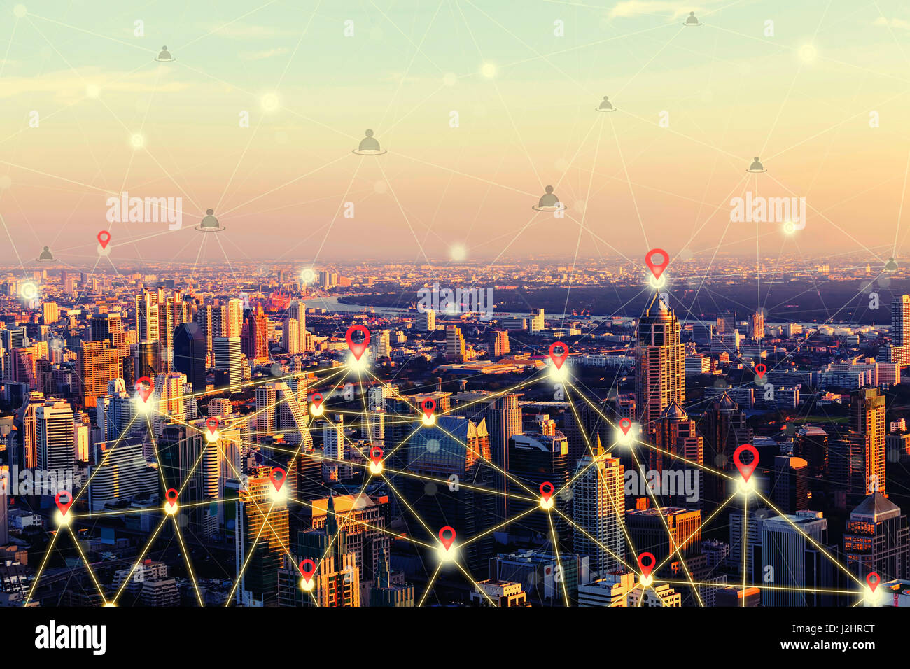 Network connection and communication concept in downtown city at sunset ...