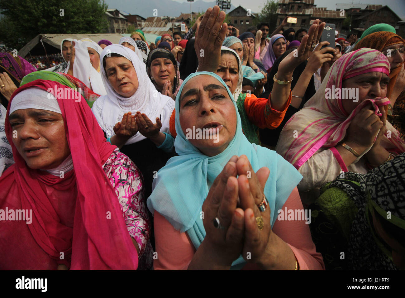 Kashmiri Women crying during devotees pray as a head priest (not seen ...
