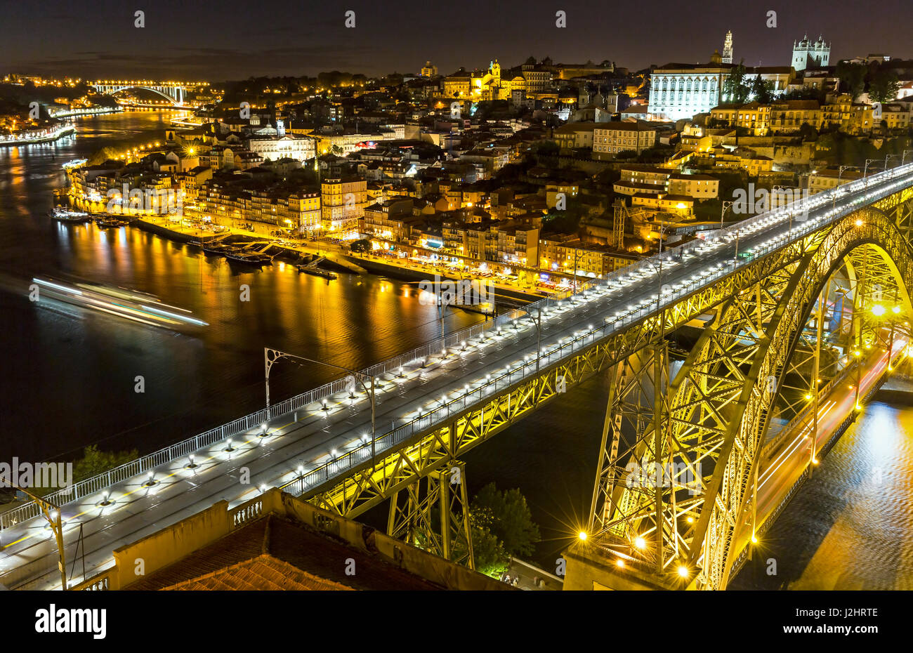 Illuminated dom luis i bridge over douro river night hi-res stock ...