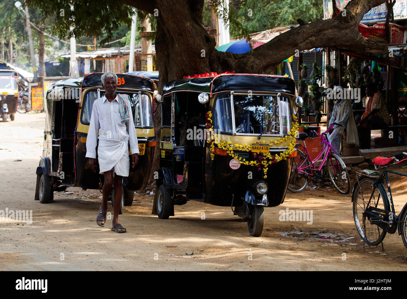 Tuk tuk decorated with flowers at the streets of Chitradurga town ...
