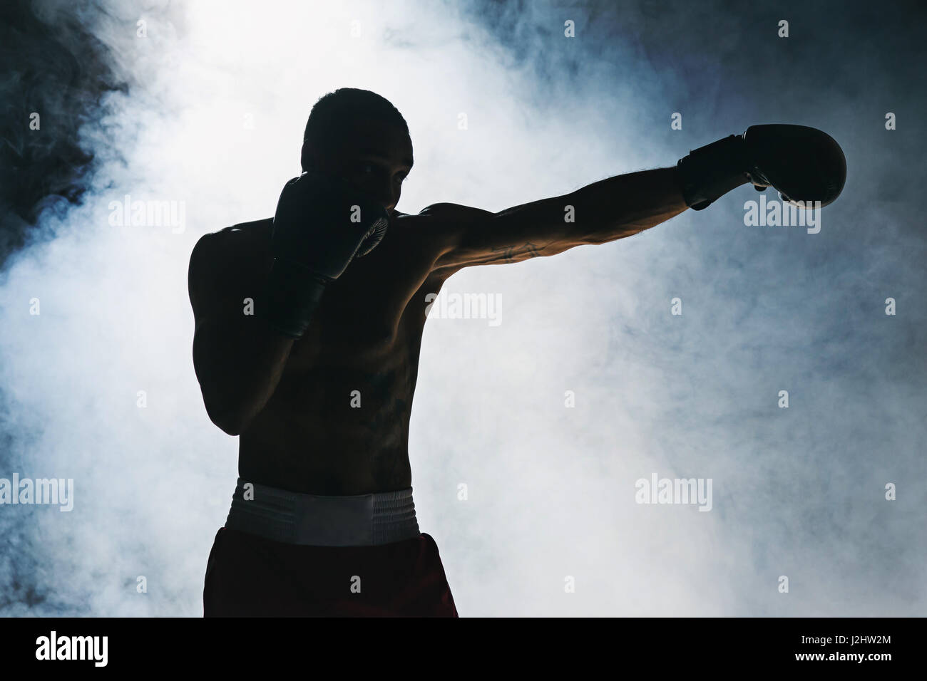 Afro american male boxer. Young man boxing workout in a fitness club ...