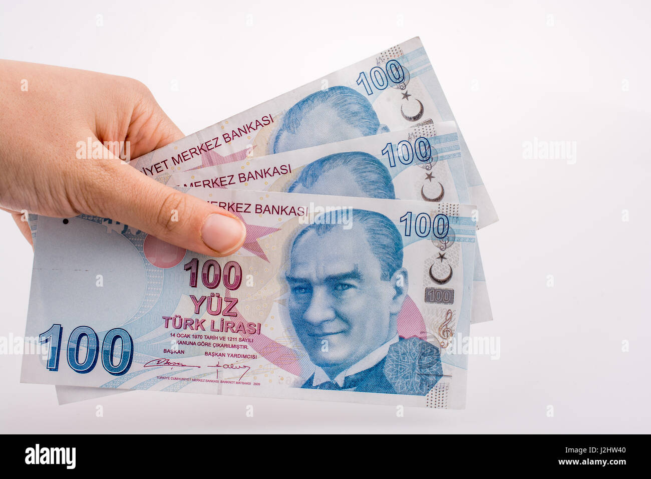 Hand holding 100 Turksh Lira banknotes on white background Stock Photo ...
