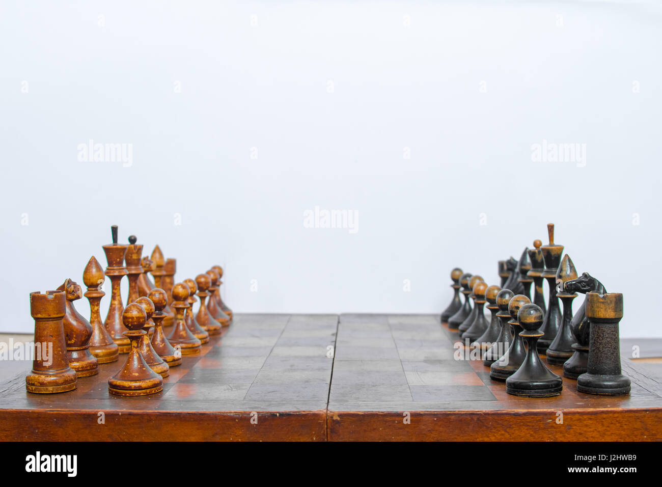 Old chess Board with wooden pieces on a white background Stock Photo ...
