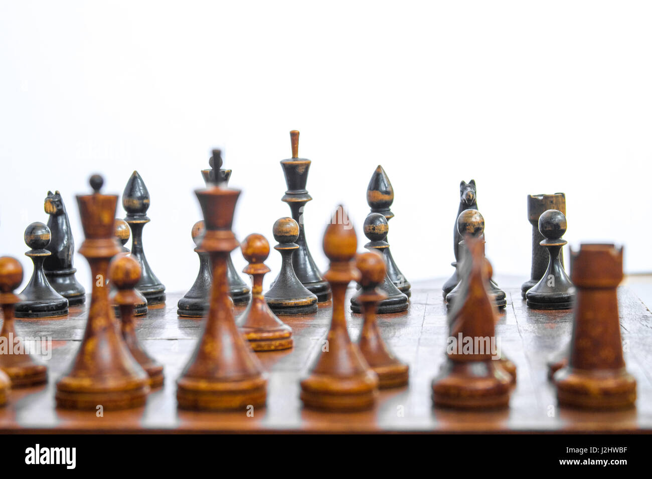 Old chess Board with wooden pieces on a white background Stock Photo ...