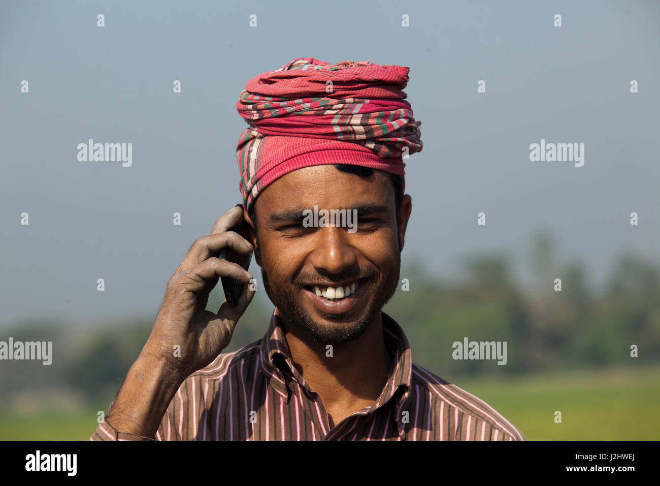 A farmer talks over the mobile phone. Munshiganj, Bangladesh Stock ...