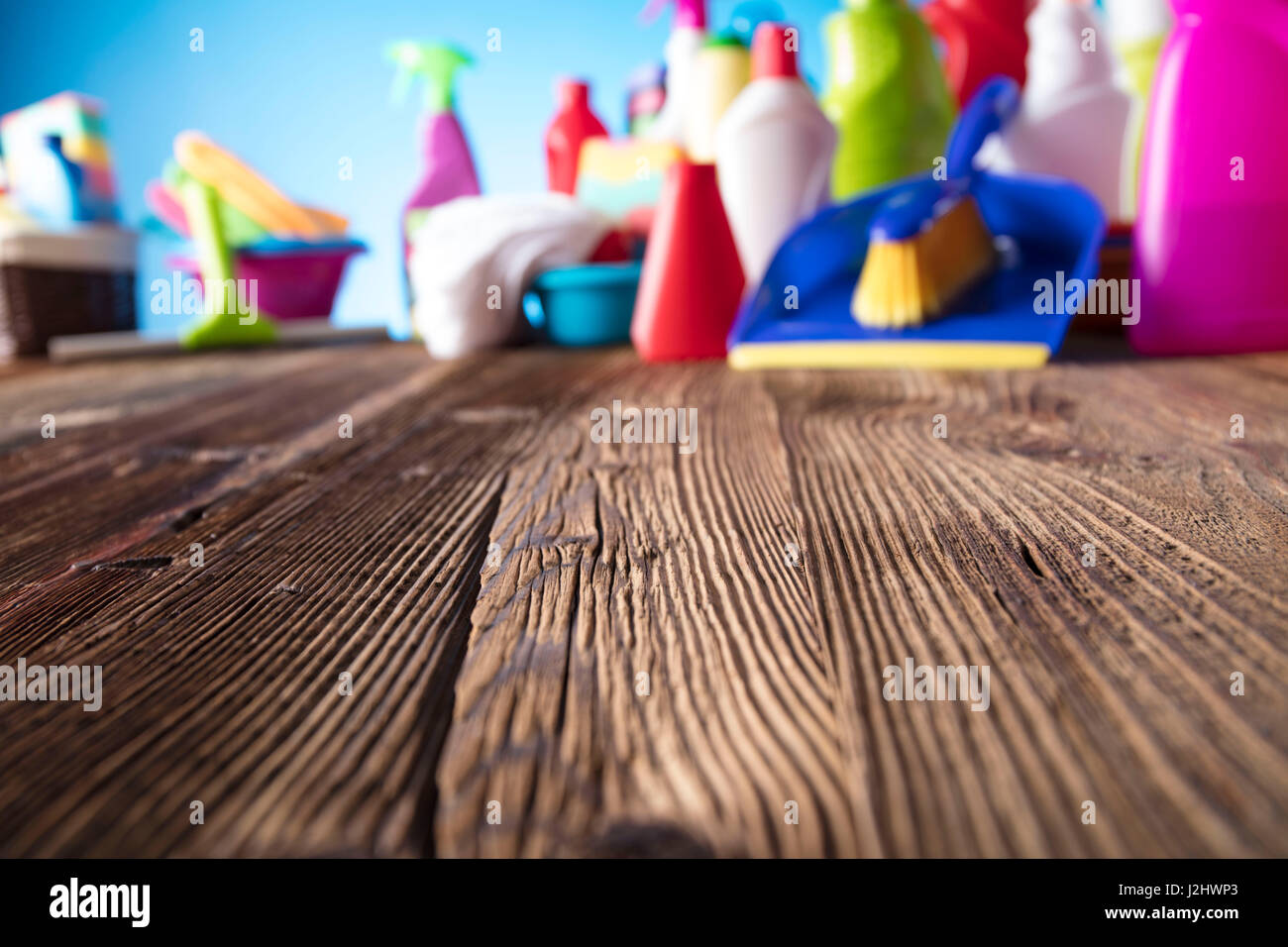 Spring cleanup theme. Variety of colorful house cleaning products on a ...