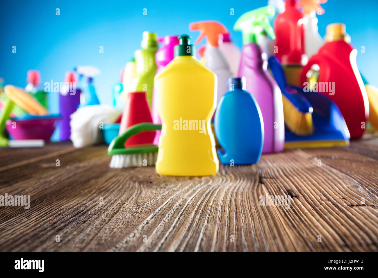 Spring cleanup theme. Variety of colorful house cleaning products on a ...