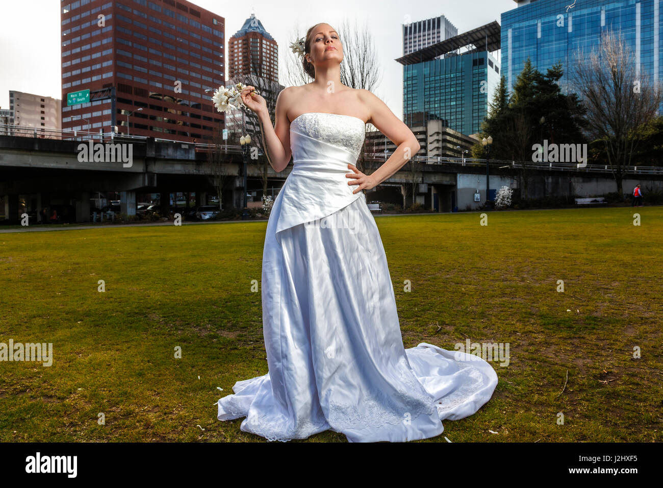 USA, Oregon, Portland. Tom McCall Waterfront Park, disgruntled bride ...