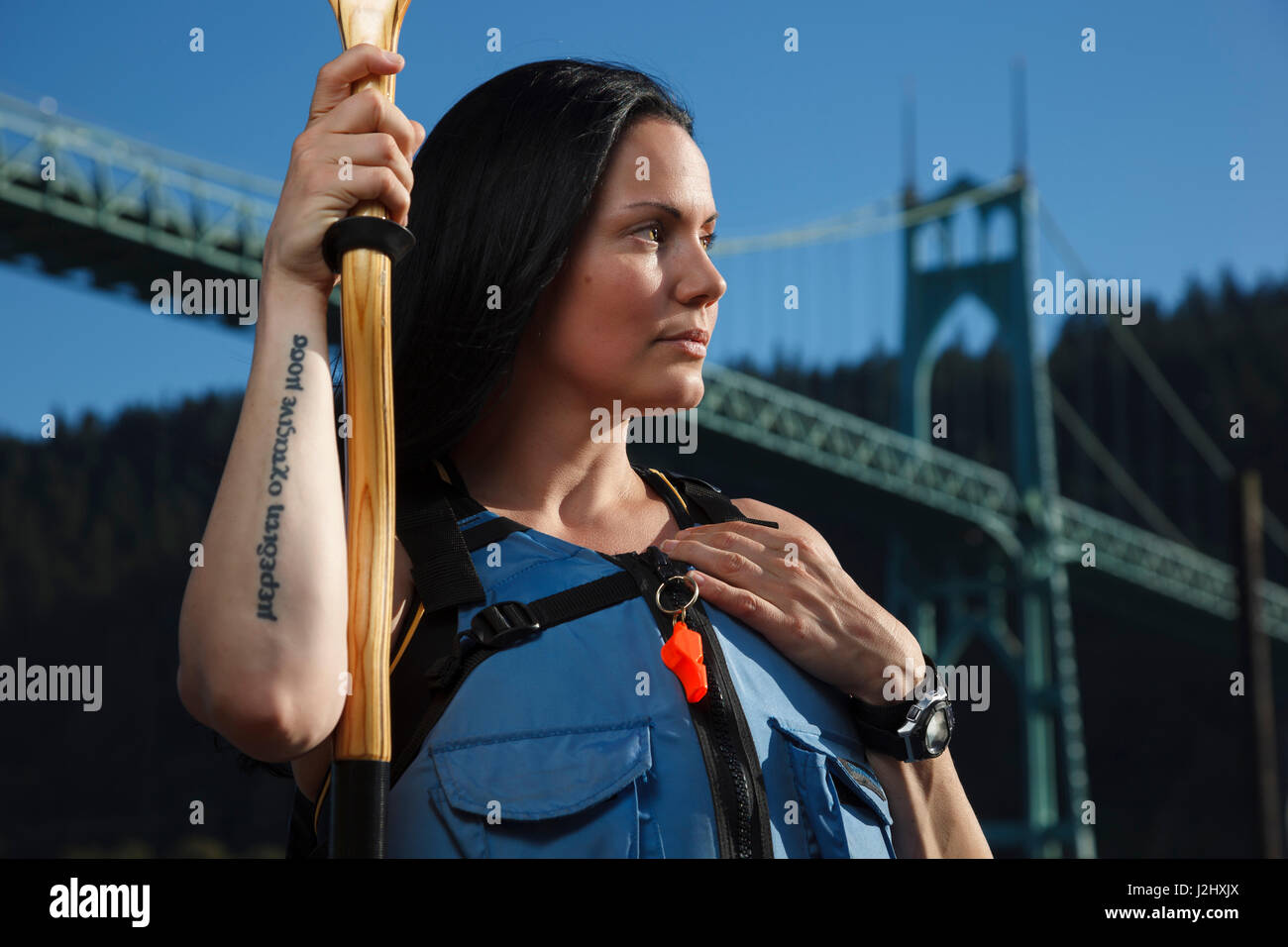 USA, Oregon, Portland, Cathedral Park, woman at Cathedral Park suited ...
