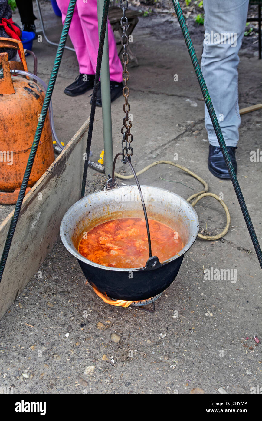 Cooking traditional stew in a kettle outdoors Stock Photo - Alamy