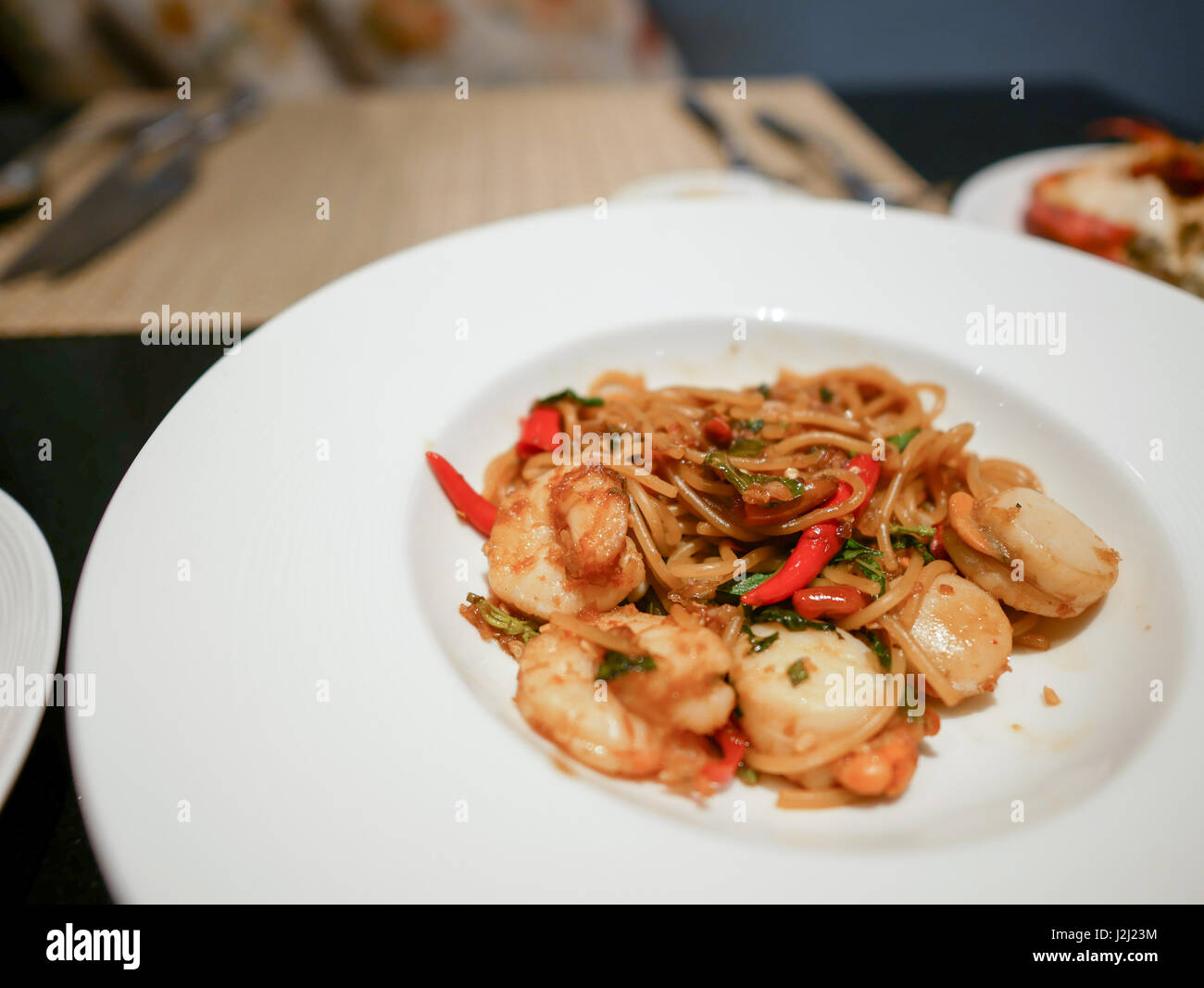 Spaghetti Pad Ki-Mao or stir fried chili seafood spaghetti in Thai ...
