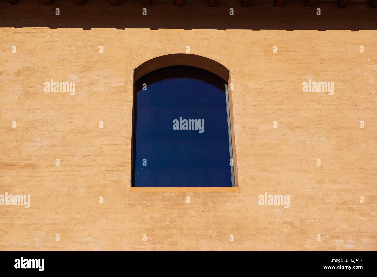modern windows of glass on the red wall Stock Photo - Alamy