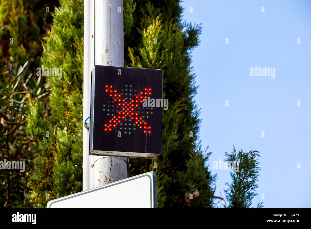 A traffic light shows red light, sign X Stock Photo - Alamy