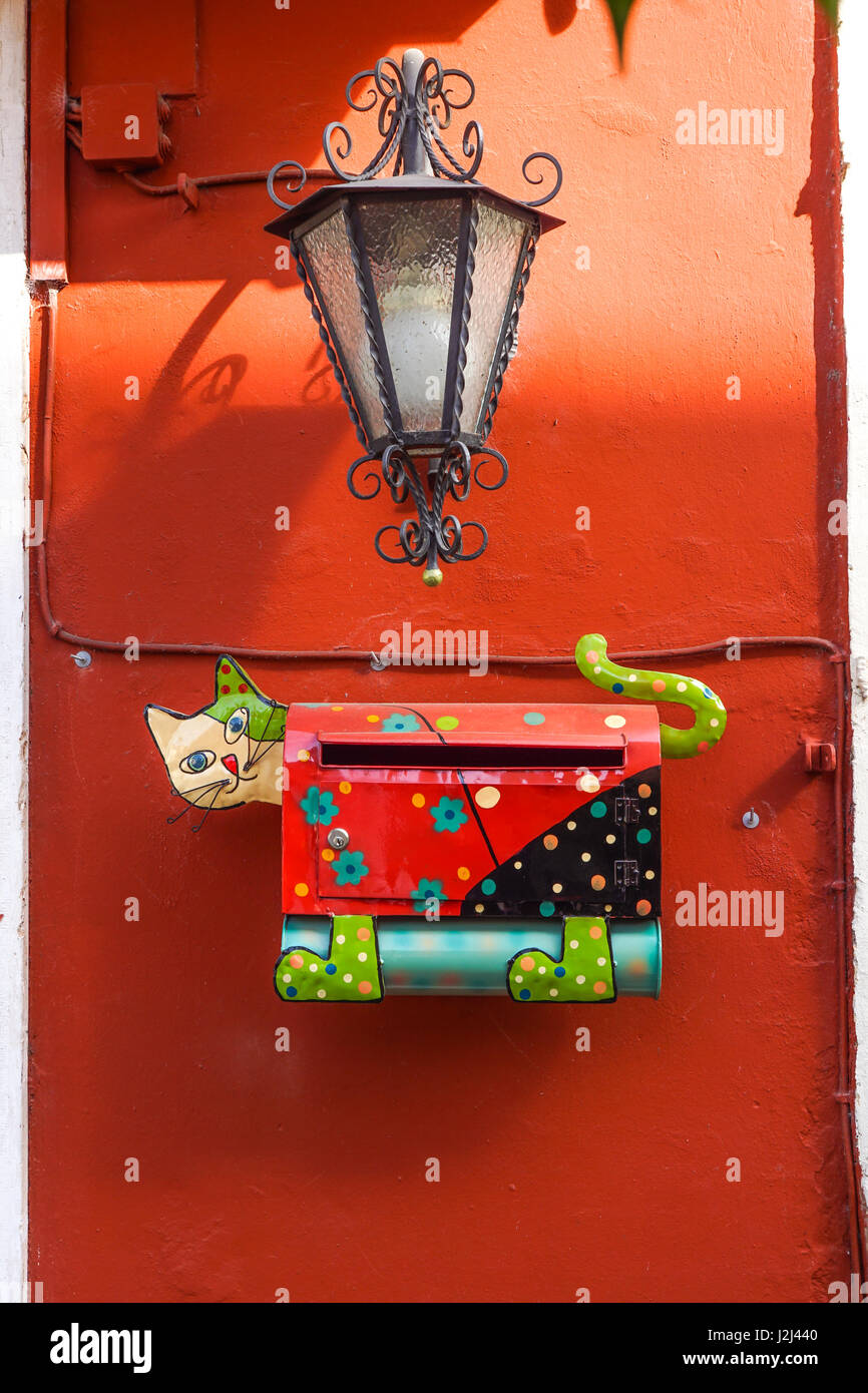 mailbox metal made in shape of a cat, on red wall Stock Photo - Alamy