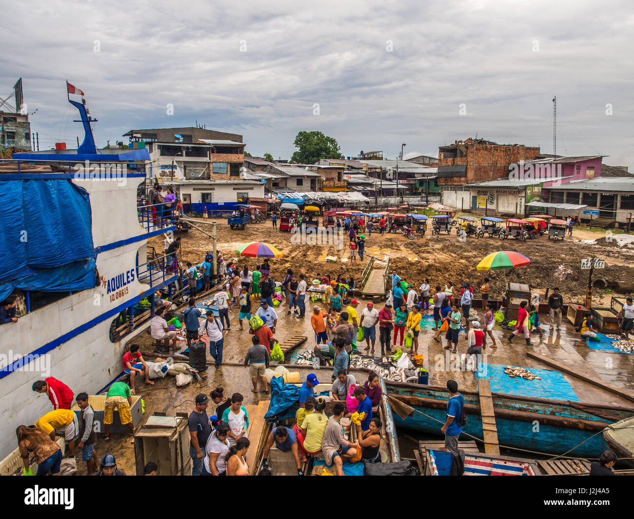 Iquitos, Peru - May 14, 2016: A crowd of local people on a board cargo ...