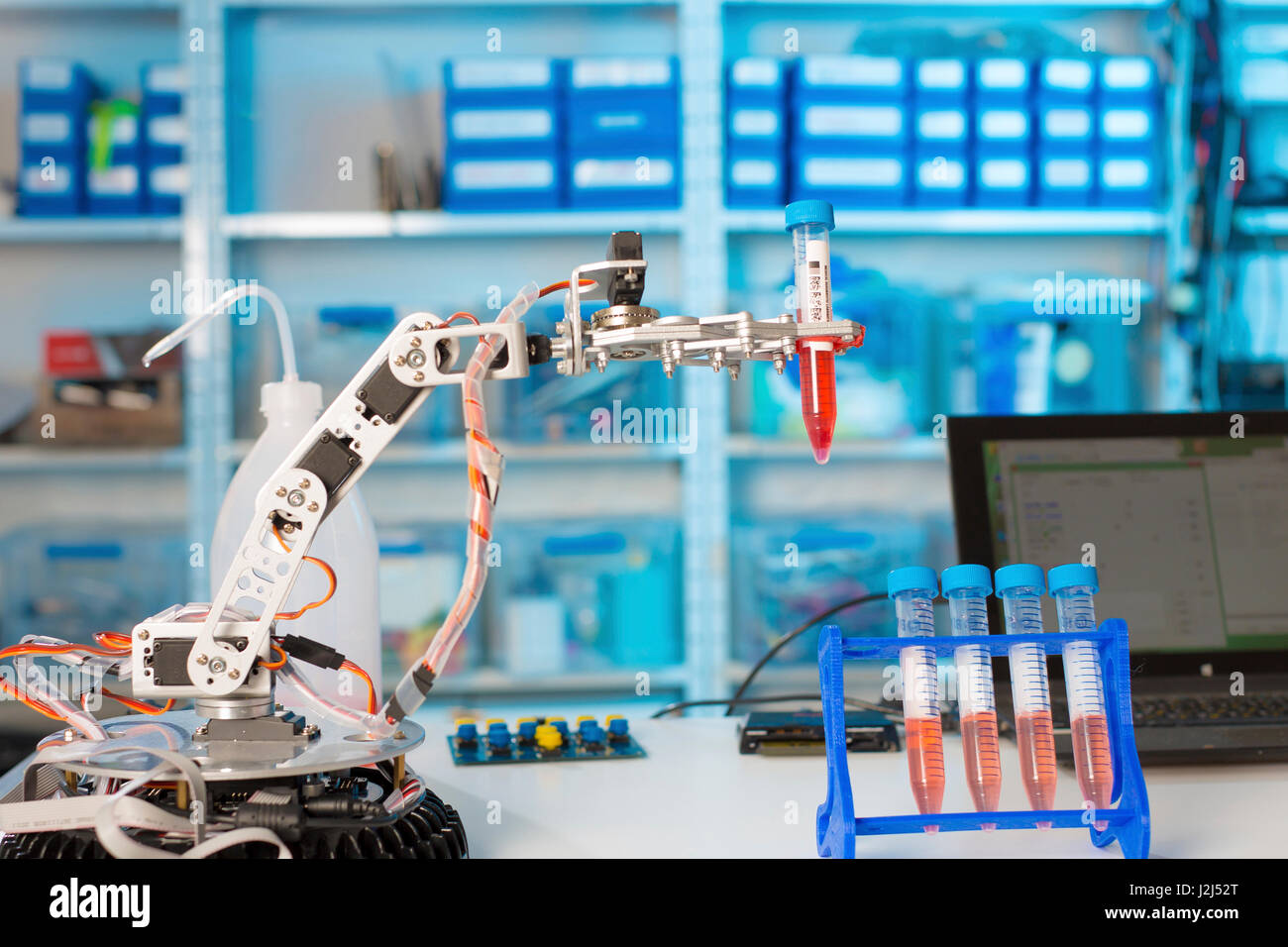 Robotic arm holding test tube in the laboratory Stock Photo - Alamy
