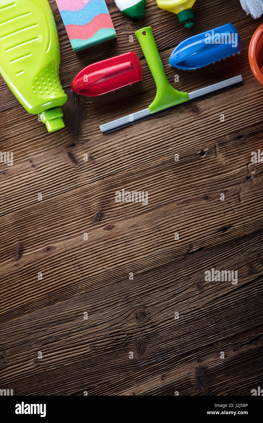 Spring cleanup theme. Variety of colorful house cleaning products on a ...