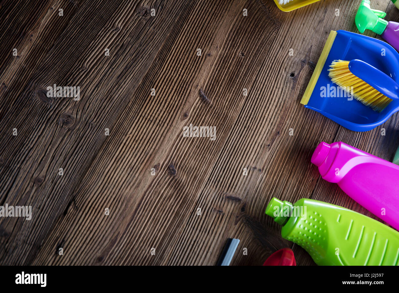 Spring cleanup theme. Variety of colorful house cleaning products on a ...