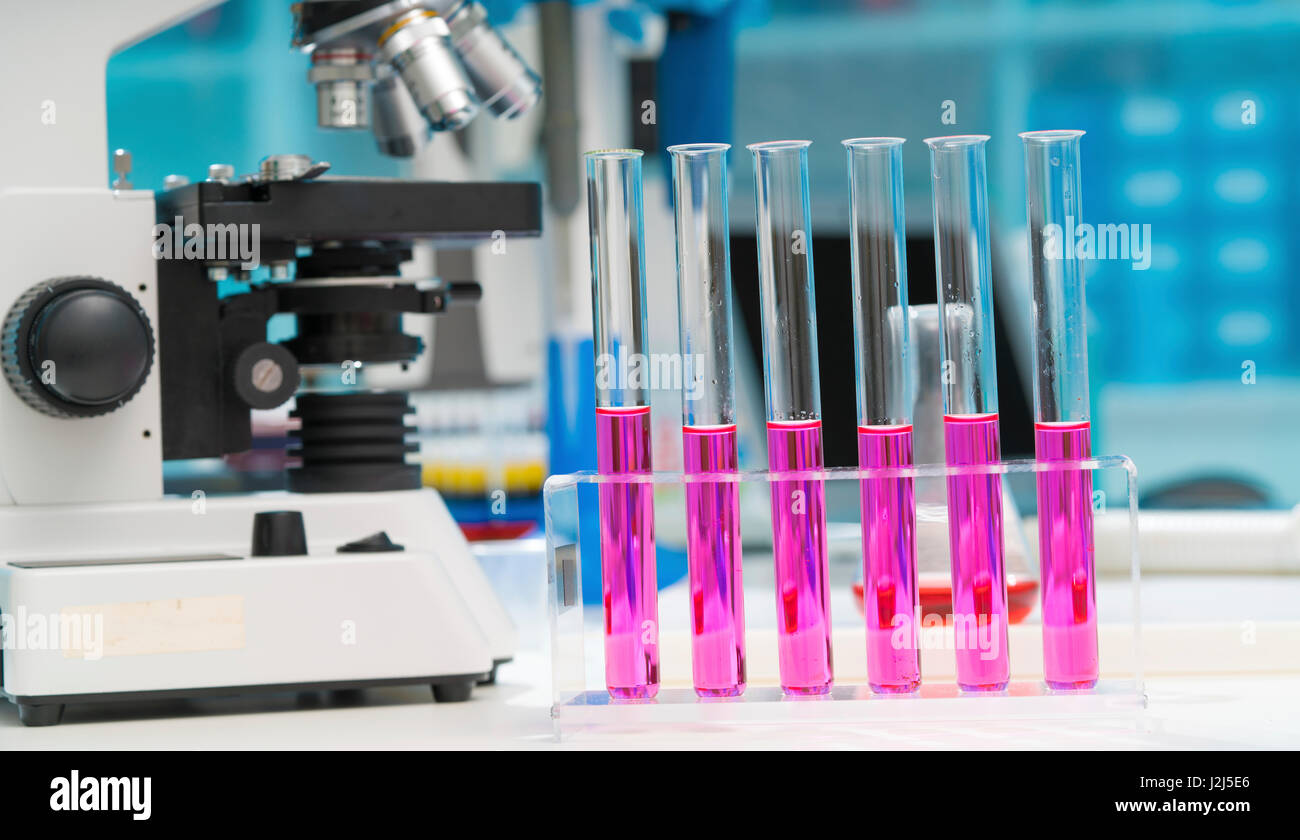 Microscope and test tubes in the laboratory Stock Photo - Alamy