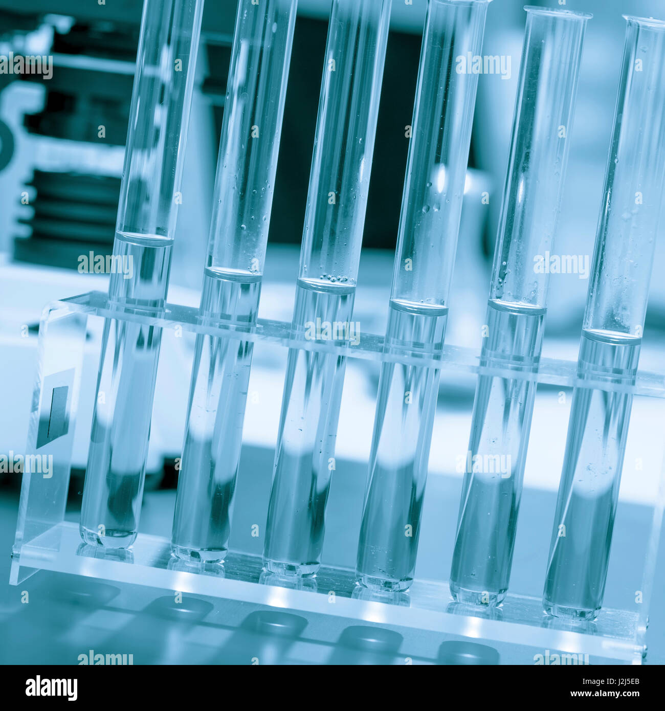 Empty tubes in a test tube rack Stock Photo - Alamy