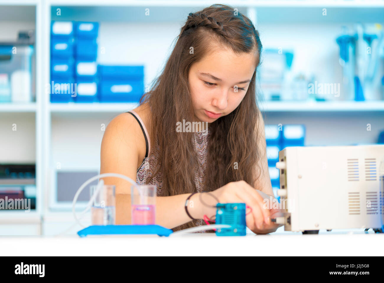 Female science student working with pem proton exchange membrane ...