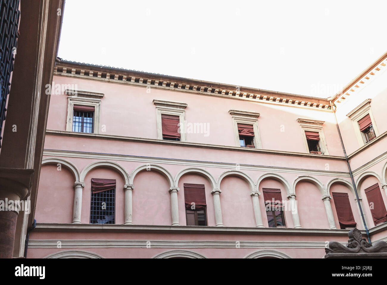 An inner courtyard - facade, window with outside blinds, background ...