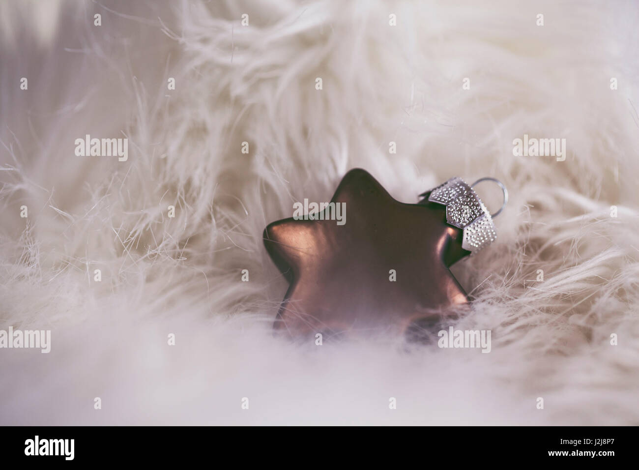 A brown Christmassy star lies on soft ground Stock Photo - Alamy