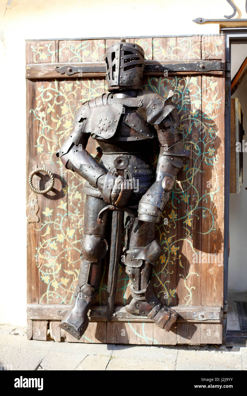 knight's armor in front of a house at the cathedral mountain, Tallinn ...