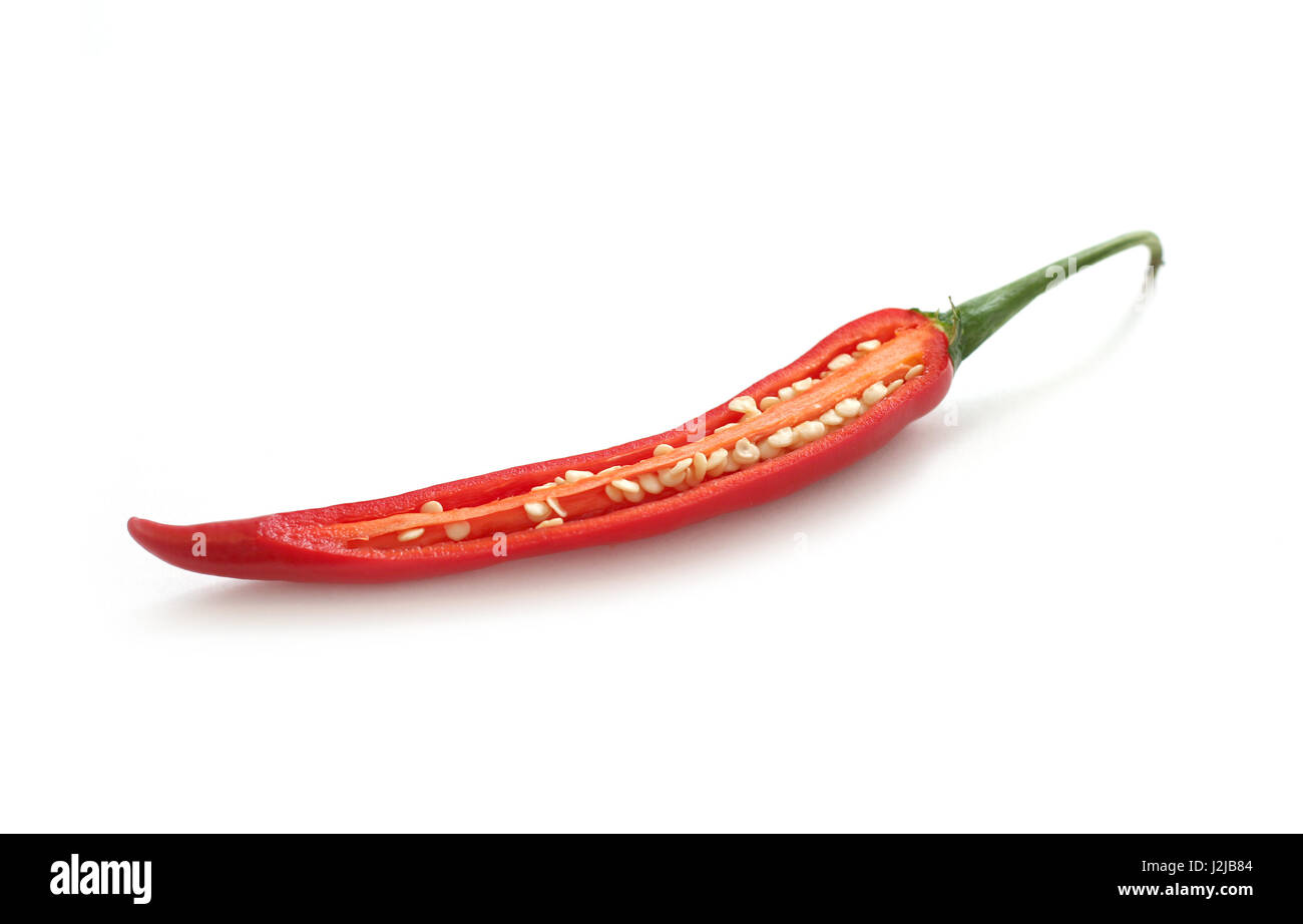 Chili pepper cut in half with seeds visible Stock Photo - Alamy