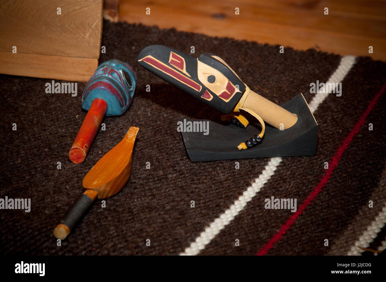 Assortment of traditional Coast Salish carved cedar wood ceremonial ...