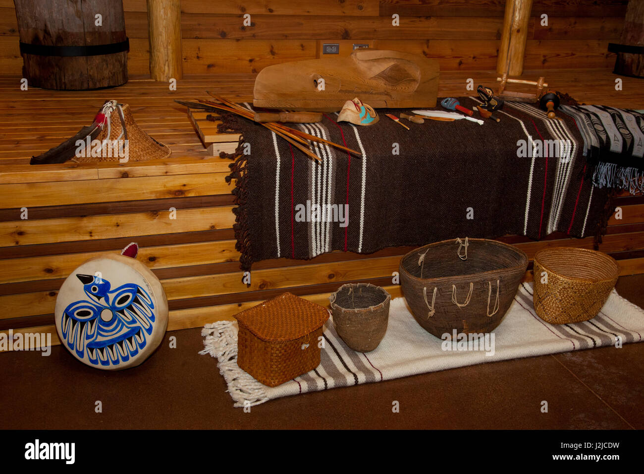 Assortment of traditional Coast Salish items, ceremonial masks, rattles ...