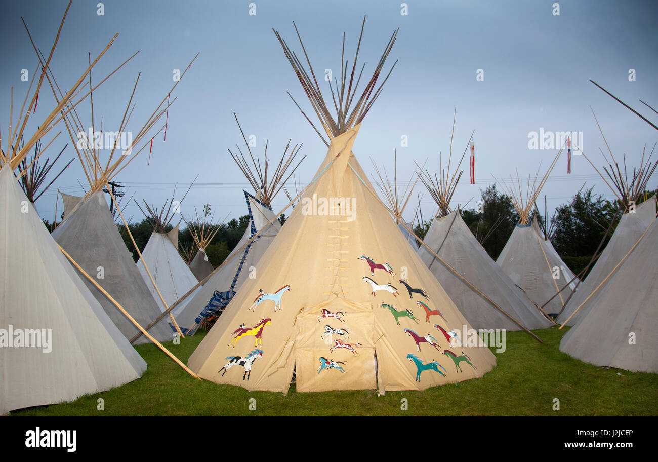 One-of-a-kind painted tipi set up inside the American Indian camp at ...